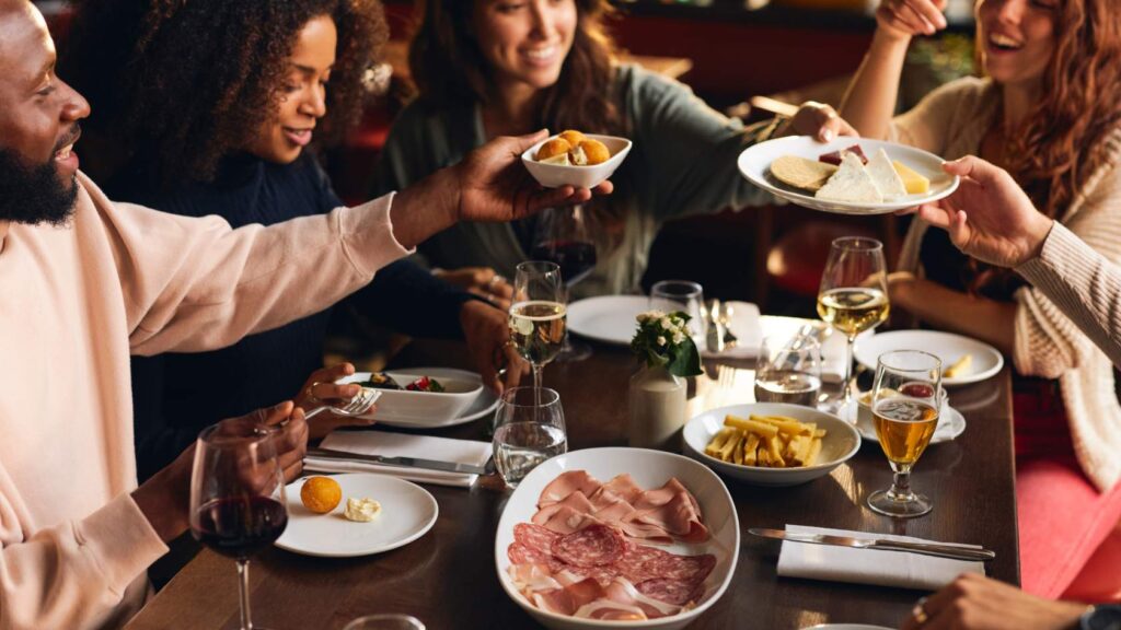 The Benefits of Offering Communal Tables and Family-Style Dining